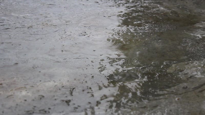 Raindrops Fall on the Road Concrete Surface Stock Footage - Video of ...