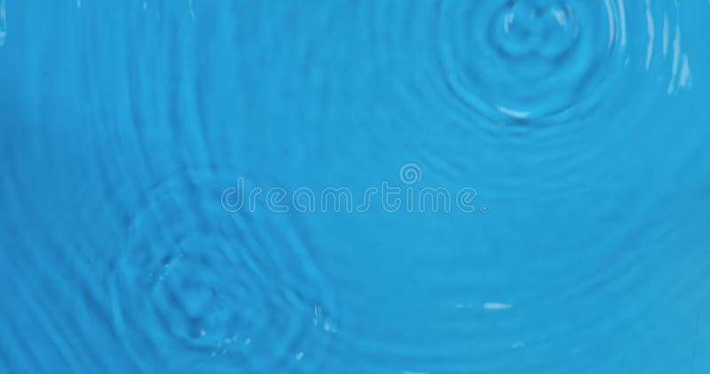 Raindrops Fall on Waves in Blue Water. Top View. Drop Falls into the ...