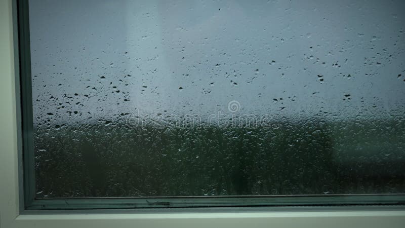 Raindrops Fall on the Window and Window Sill, Flowing Down Stock ...