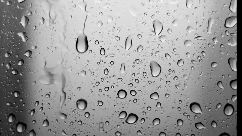 Raindrops Falling Down the Window Glass. Abstract Background of Raindrops in Gray Tones Stock ...