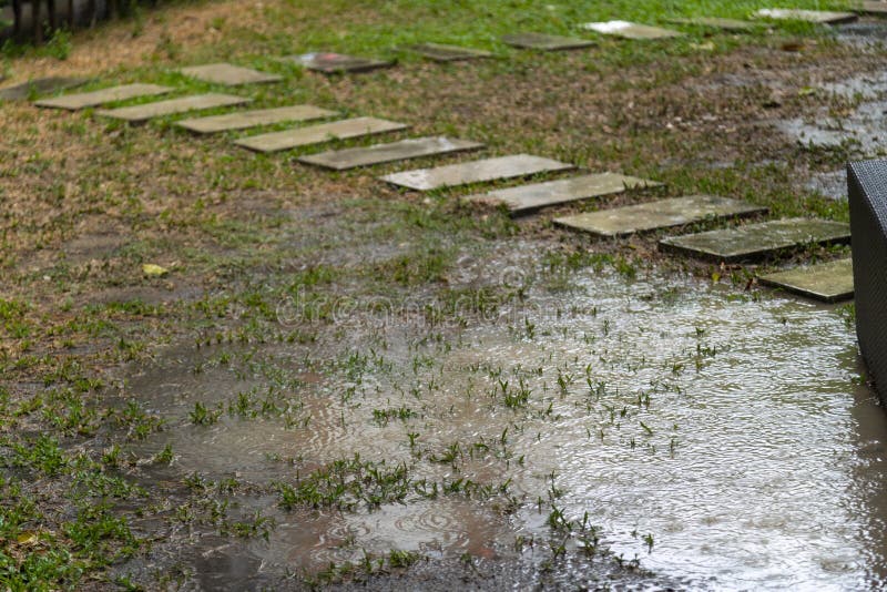 Raindrop Flooding on Glass and Footpath with the Rain Stock Image ...