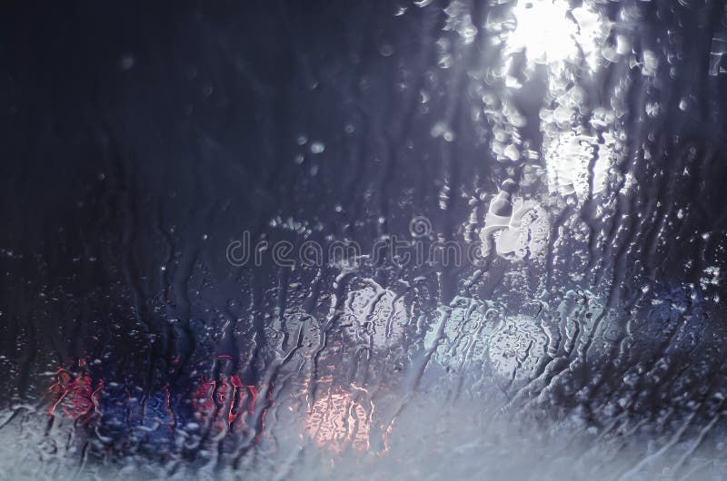 Raindrops Flowing on the Glass Window at Night Stock Photo - Image of ...