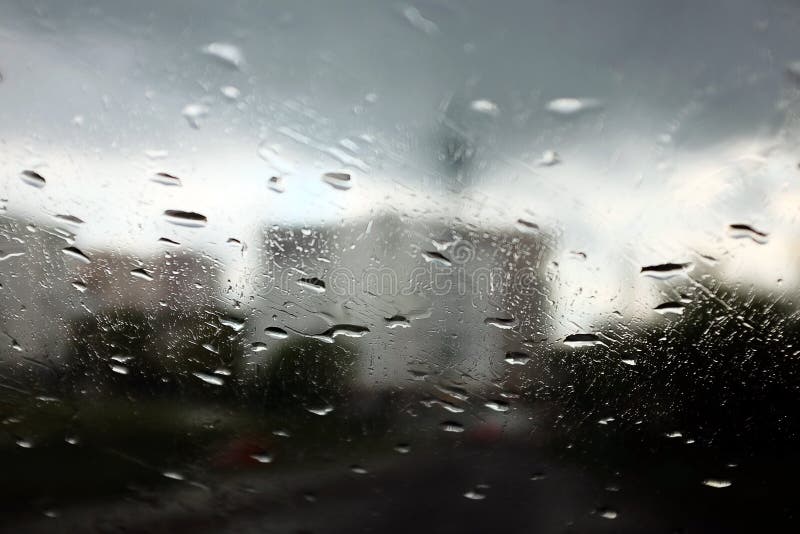 Raindrops on the Glass. Blurry Rainy Gray Background and City View ...