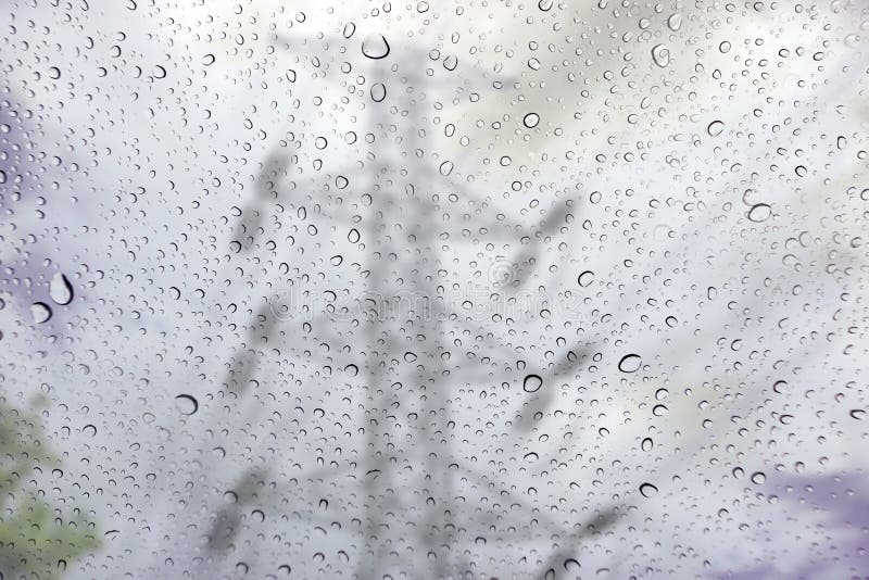 Raindrops on Glass with High Voltage Electrical Pole and Raining Cloud ...