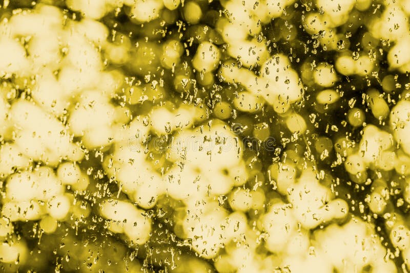 Raindrops on Glass. Yellow Background. Wet Surface Stock Photo - Image ...