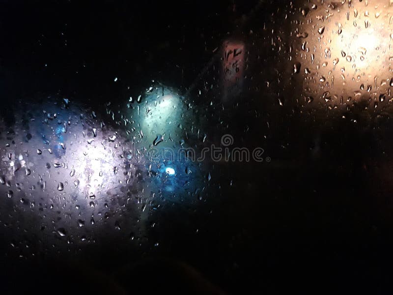 Raindrops Hitting the Windshield of the Car and Reflecting Off the ...