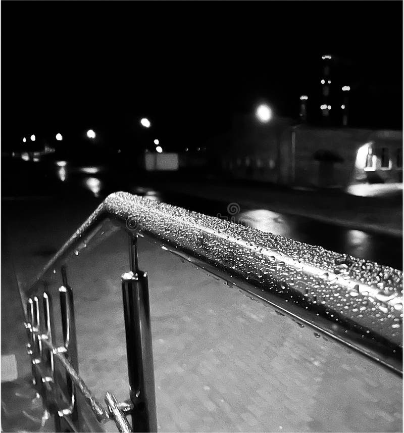 Raindrops at Night Under a Lantern on a Metal Pipe Stock Photo - Image ...
