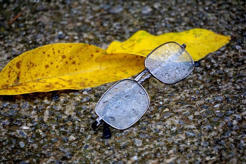 Raindrops on Reading Glasses Placed on a Concrete Background. Stock ...