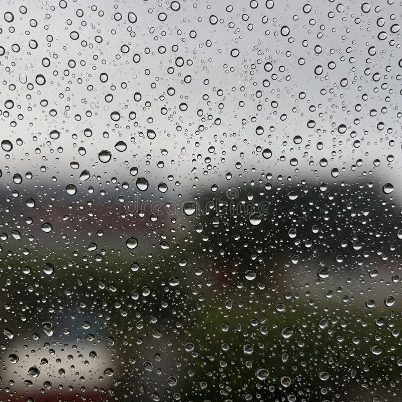 Raindrops Scatter Across a Glass Window, Creating a Pattern of Varying ...