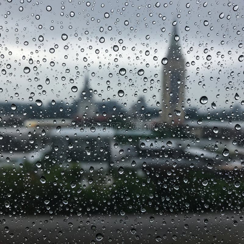 Raindrops are Scattered Across a Transparent Surface, Providing a ...