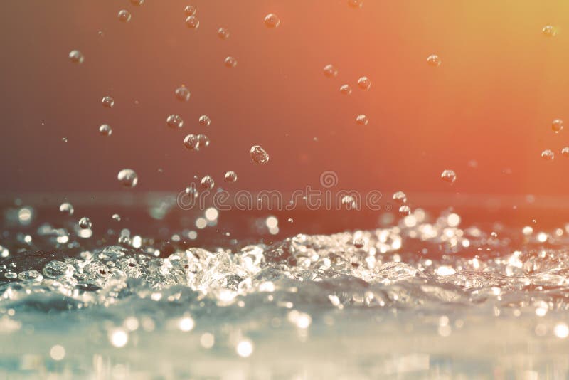 Raindrops Splashes on Sunset. Stock Photo - Image of impact ...
