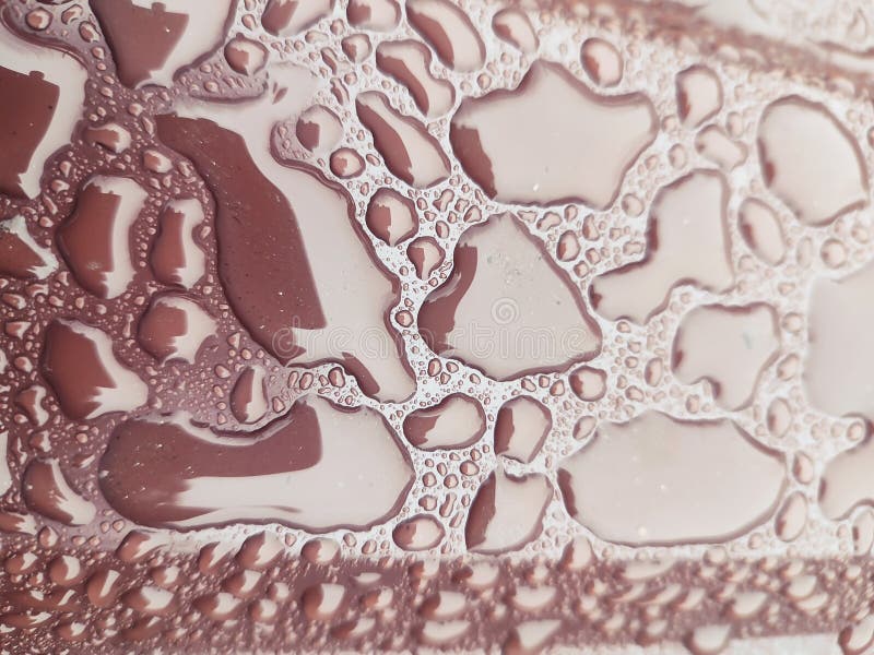 Raindrops Under Plastic Wrap on Brown Surface Stock Photo - Image of ...