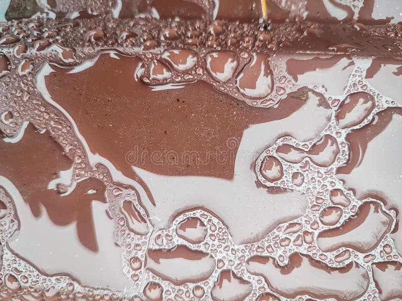 Raindrops Under Plastic Wrap on Brown Surface Stock Image - Image of ...