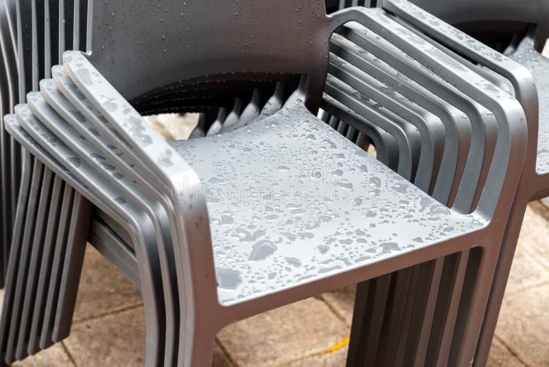 Raindrops on the Wet Surface of Gray Plastic Chairs Stock Photo - Image ...