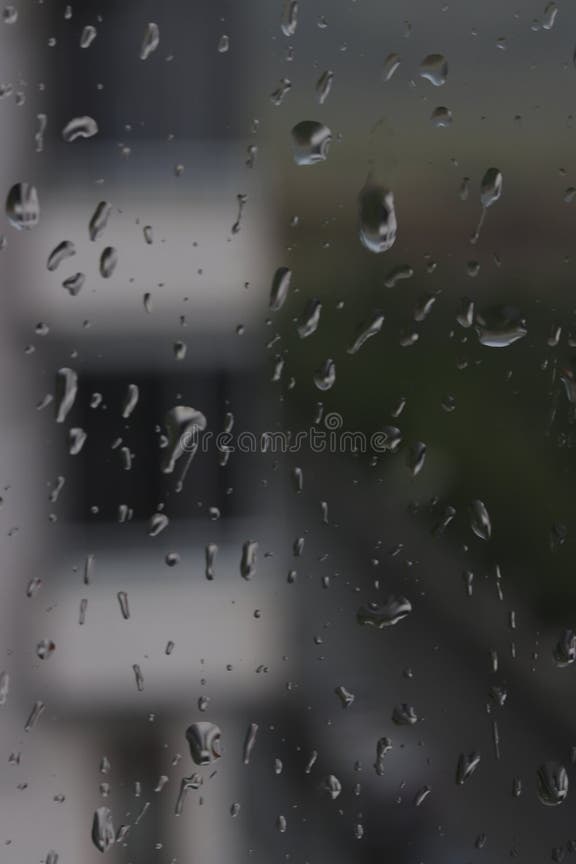 Raindrops on a Window with Blurred Background, Evoking Feelings of ...