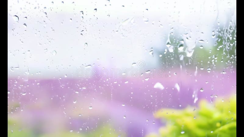 Raindrops on a Window with a Blurred, Pastel-colored Background Stock ...