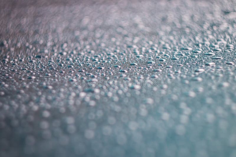 Raindrops on the Window Glass with a Blurred Background of City Lights ...