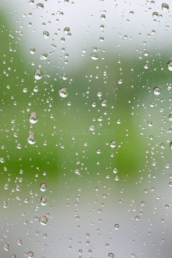 Raindrops on window glass stock photo. Image of color - 122346436