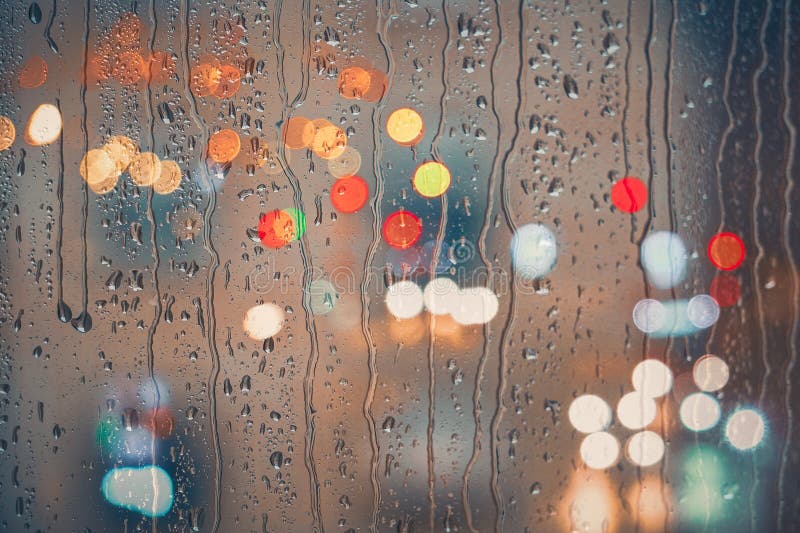 Raindrops on the Window and Multi Colored Street Lights at Night Stock ...