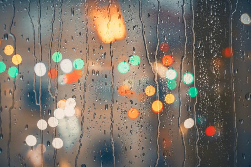 Raindrops on the Window and Multi Colored Street Lights at Night Stock ...