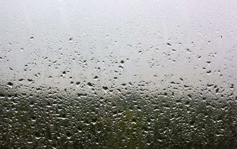 Raindrops on the Window Pane Outside the Window You Can See the Green ...