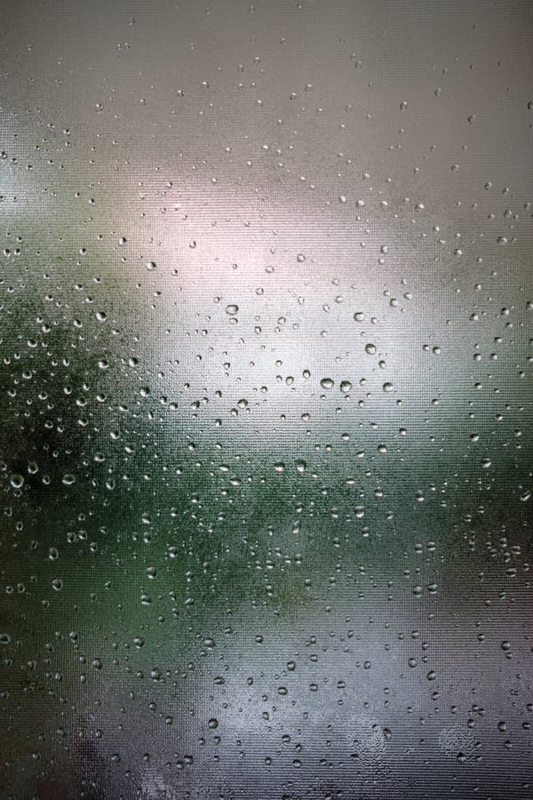 Raindrops on a window stock image. Image of surface - 218779573