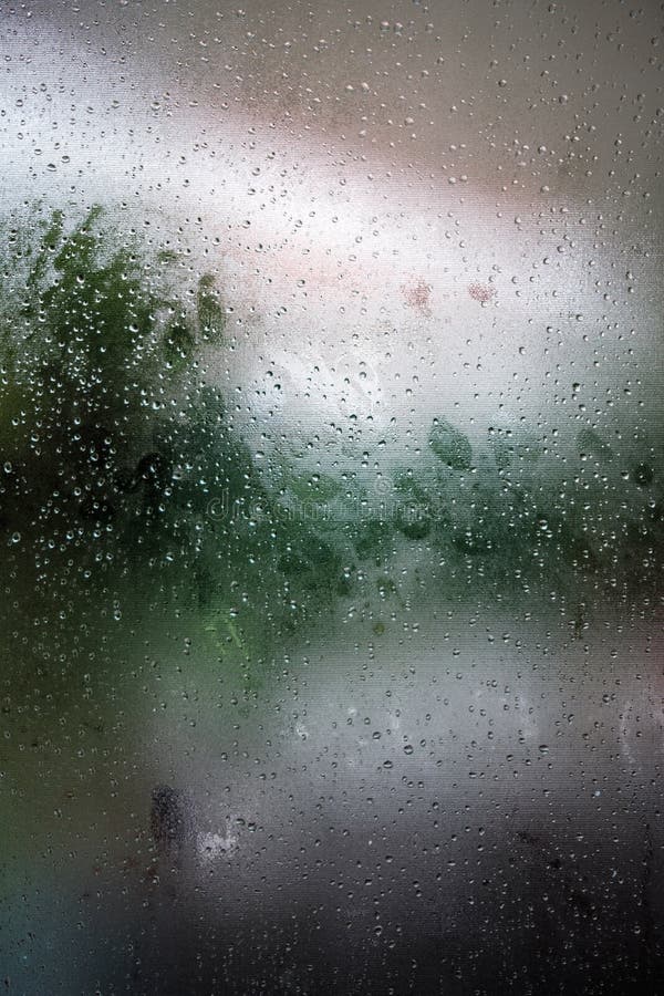 Raindrops on a window stock photo. Image of moisture - 218779600