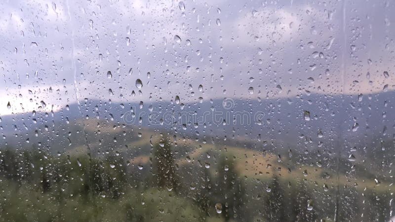 Raindrops on the window. stock video. Video of landscape - 347272123