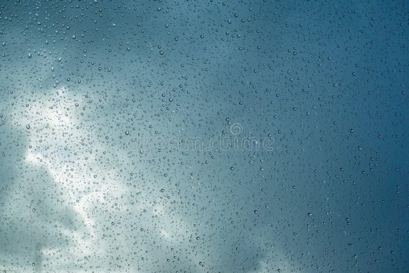 Raindrops on the Windshield; in the Background Dark Sky and a Break in ...