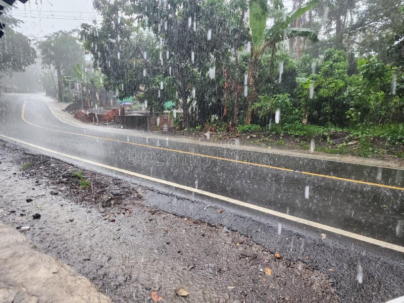 It Rained Suddenly in the Middle of the Road Stock Photo - Image of ...