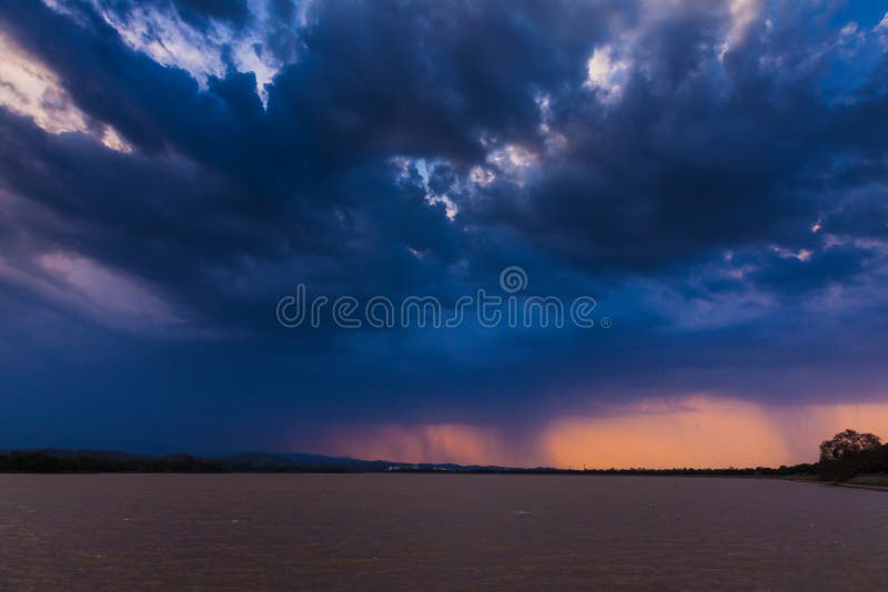 Raining across the lake. stock photo. Image of raining - 71137534