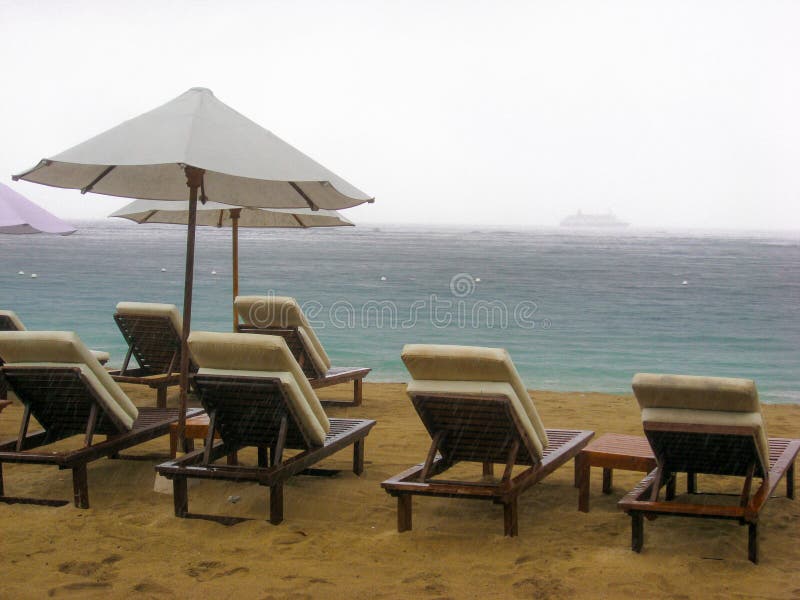 Raining beach stock photo. Image of seaboat, sand, lido - 27699772