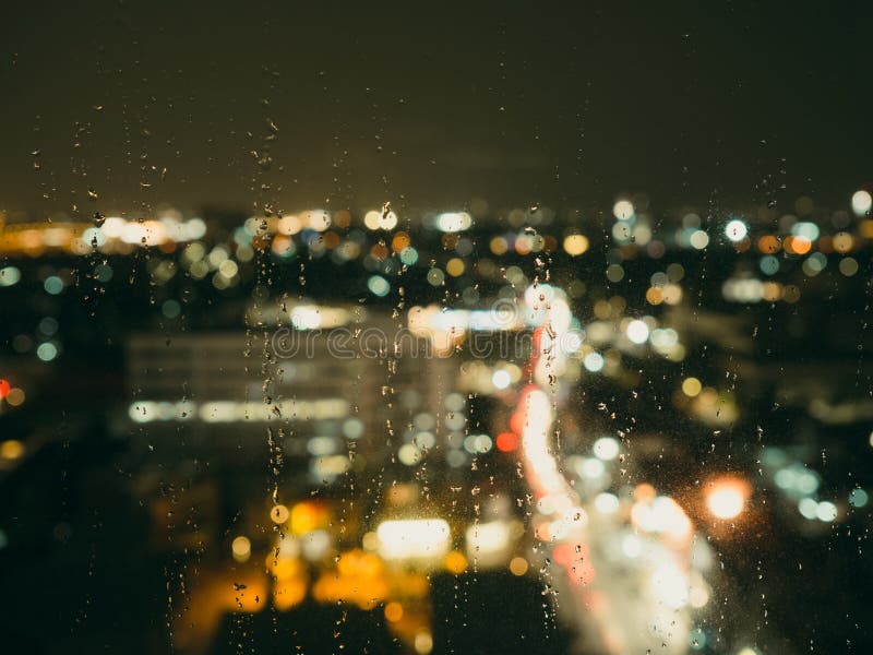 Raining Cityscape at Night from Windows. Stock Photo - Image of ...