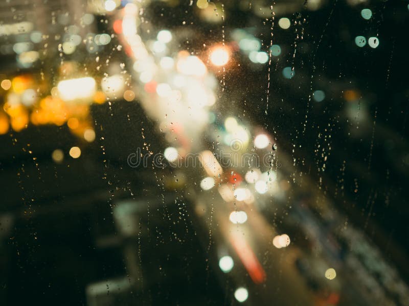 Raining Cityscape at Night from Windows. Stock Image - Image of ...