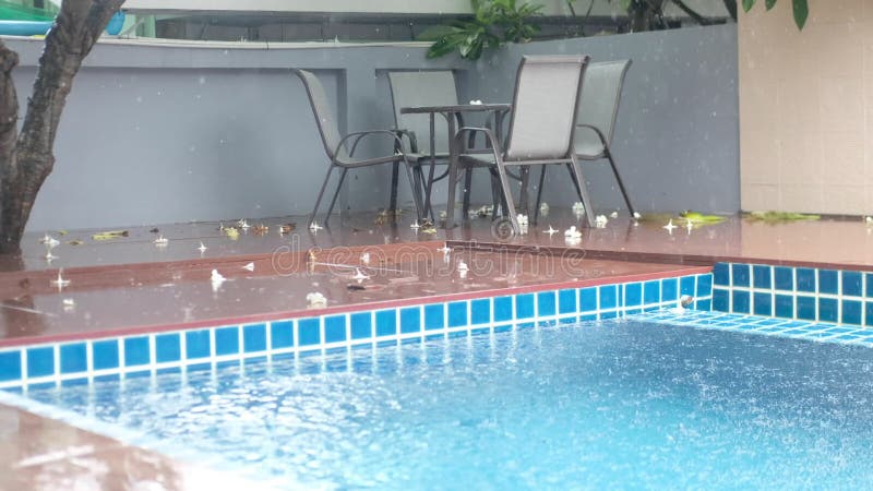 Raining Falling on Swimming Pool in Resort. Stock Footage - Video of ...
