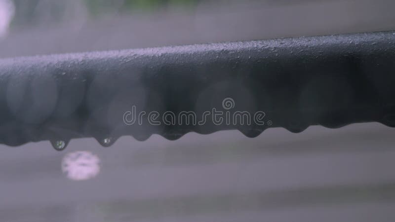 Camera Static through a Window on Raindrop Sticks on a Clothes Rack and ...