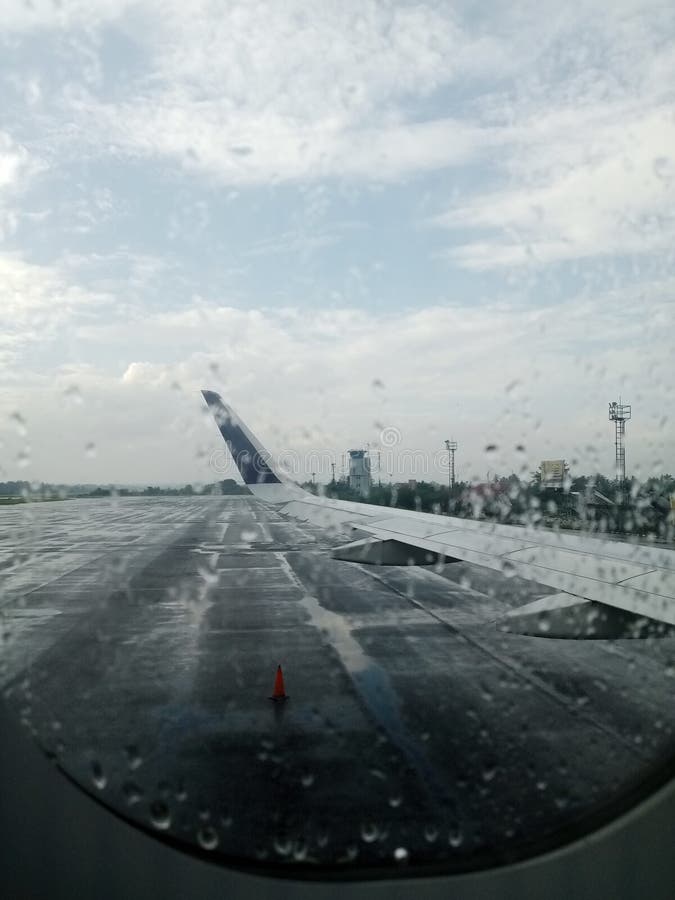 Rain in the airplane editorial photography. Image of raining - 266972132