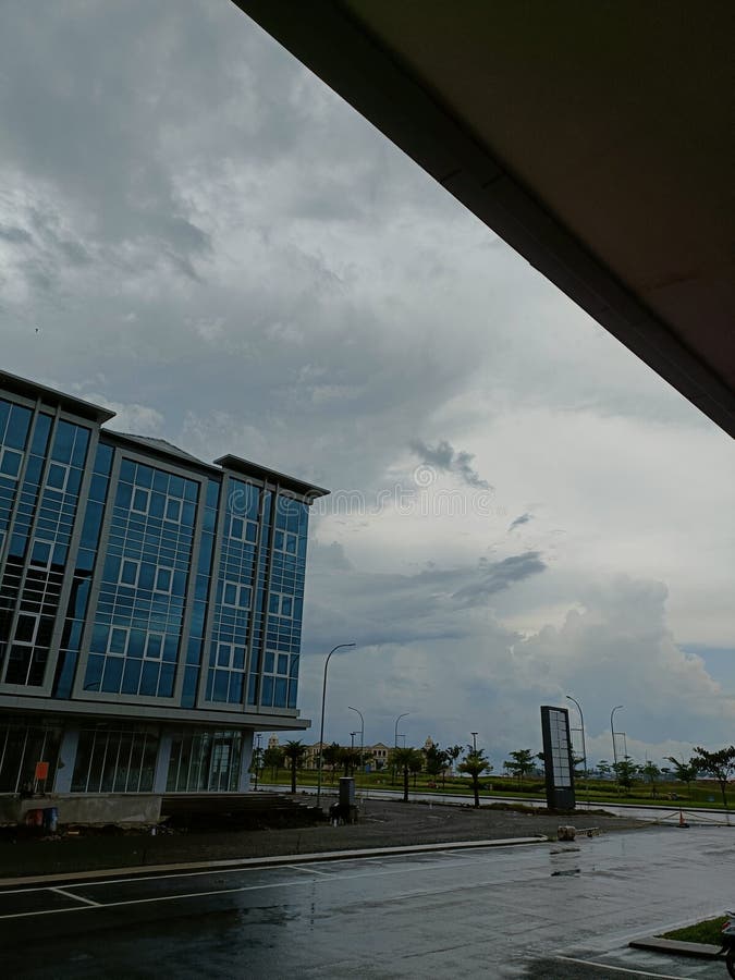 Raining at normal city stock photo. Image of stadium - 264223814
