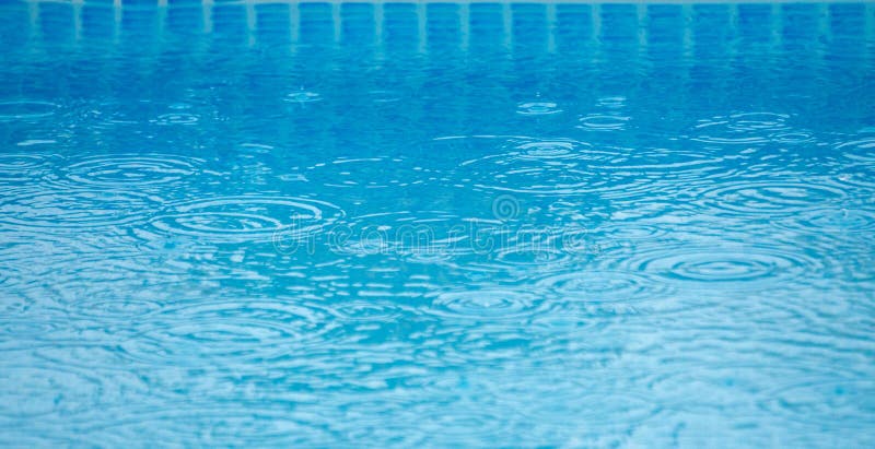 Raining on pool water stock photo. Image of graphic - 325090780