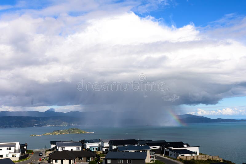Raining and Rainbow Over Harbour Stock Image - Image of cloudy, island ...