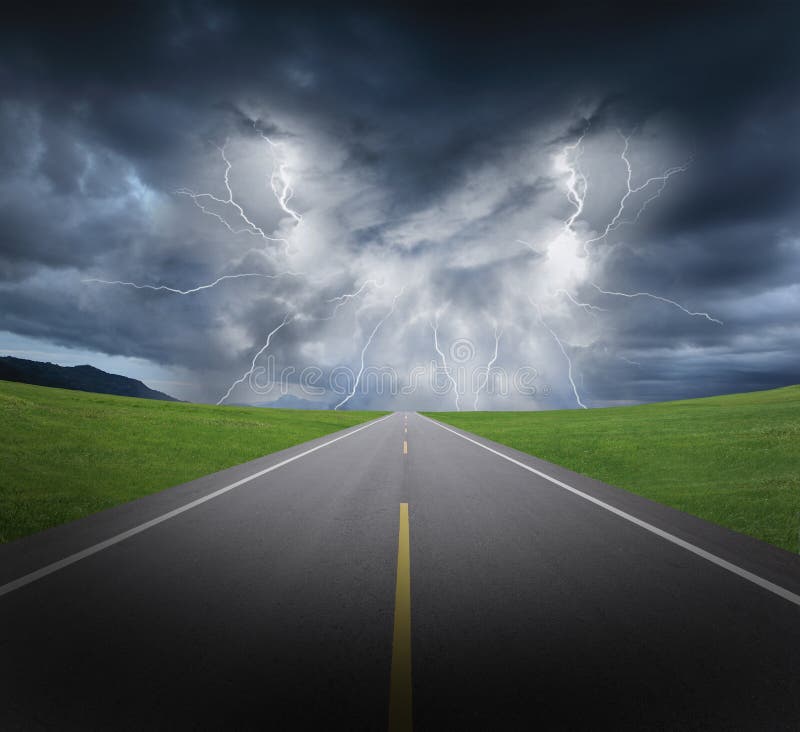 Rainstorm Clouds and Lightning with Asphalt Road and Grass Stock Photo ...