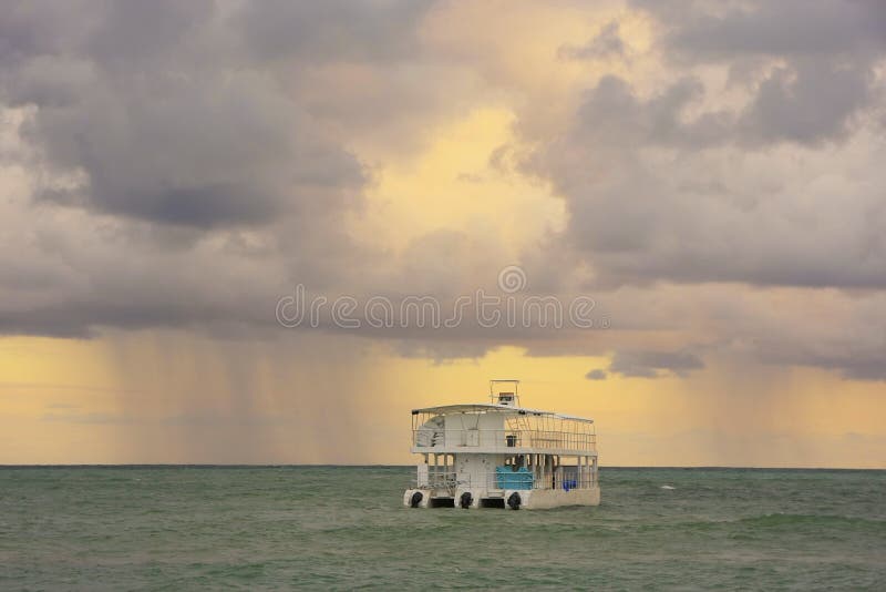 Rainstorm in a Sea at Sunrise Stock Photo - Image of ocean, rainstorm ...
