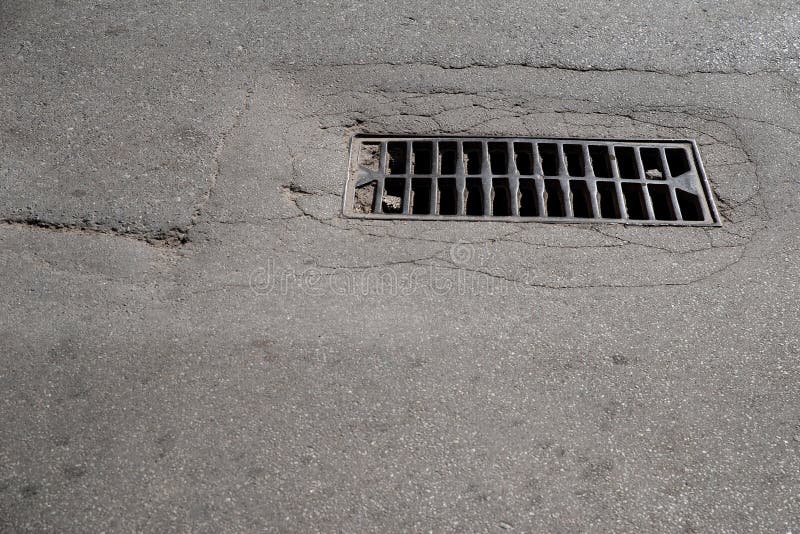Rainwater Drainage Grate on Gray Asphalt Stock Image - Image of sewer ...