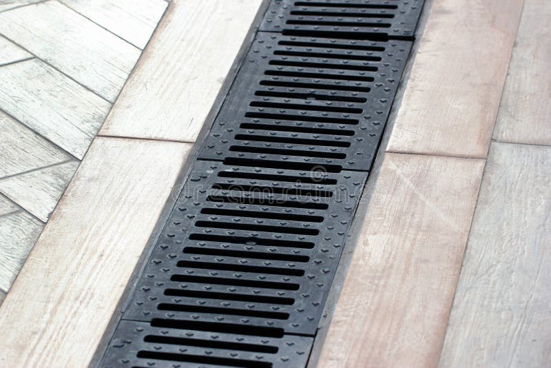 Rainwater Drainage System on a Sidewalk Stock Image - Image of city ...