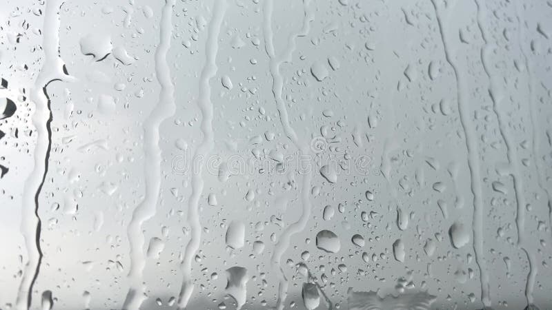 Rainwater Drops Falling Down on the Window Glass Stock Footage - Video ...