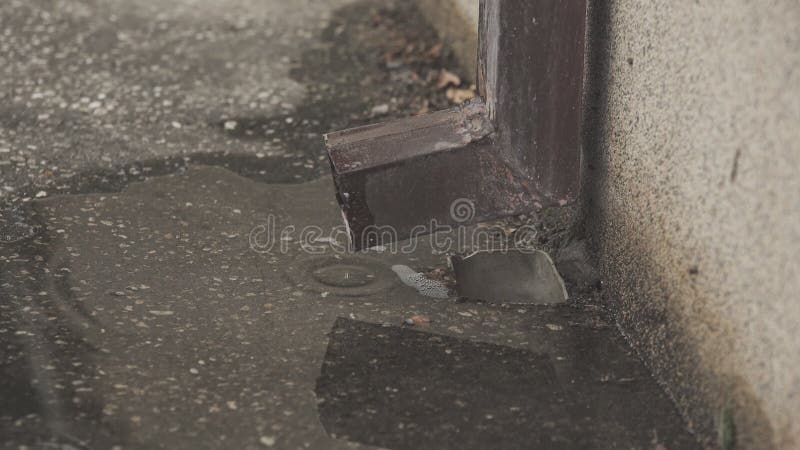 Rainwater Flowing from Gutter into Puddle Stock Footage - Video of ...