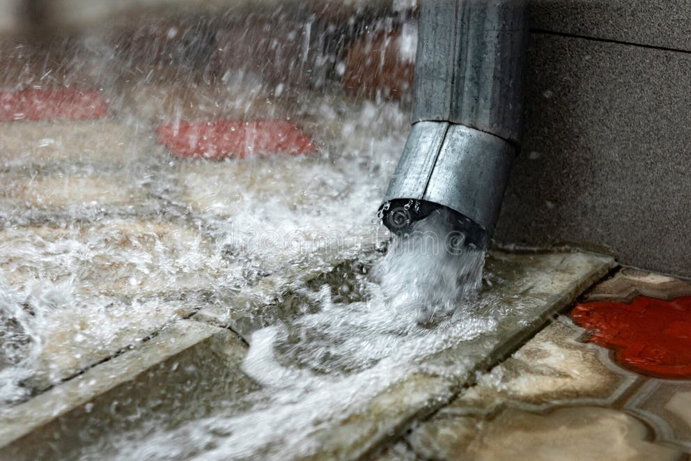Rainwater Flows from the Gutter during a Heavy Rain. Stock Photo ...