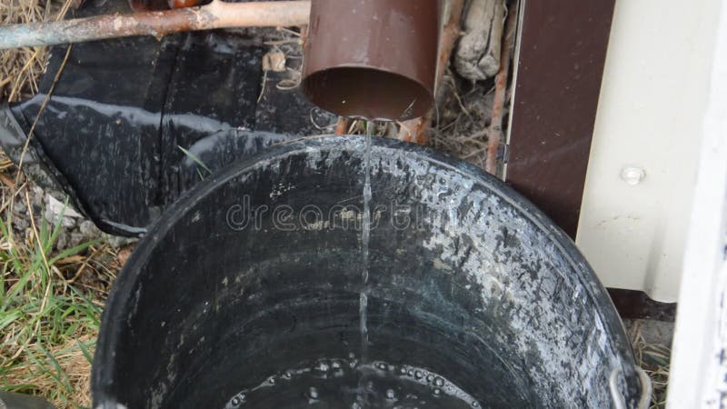 Rainwater Pours Down the Drain into Buckets Stock Footage - Video of ...