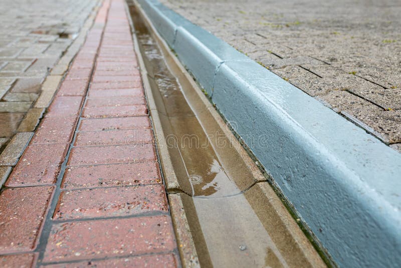 Rainwater Runoff during Rain. Concrete Gutter for Rainwater Drainage ...