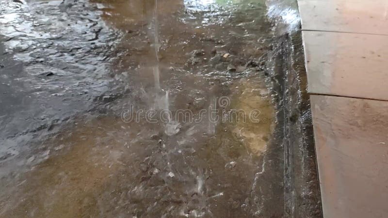 Rainwater Splashes Onto Concrete Surface during a Heavy Downpour Stock ...
